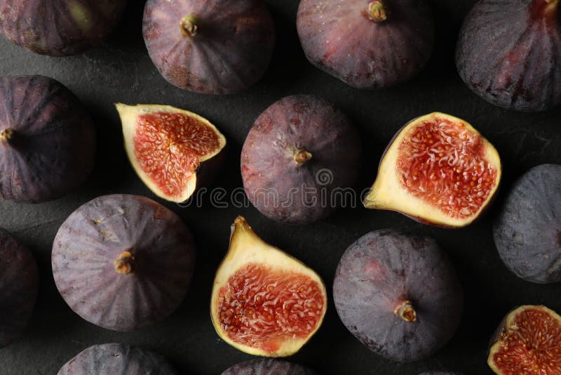 Tasty Cut and Whole Figs on Black Table, Flat Lay Stock Image - Image ...