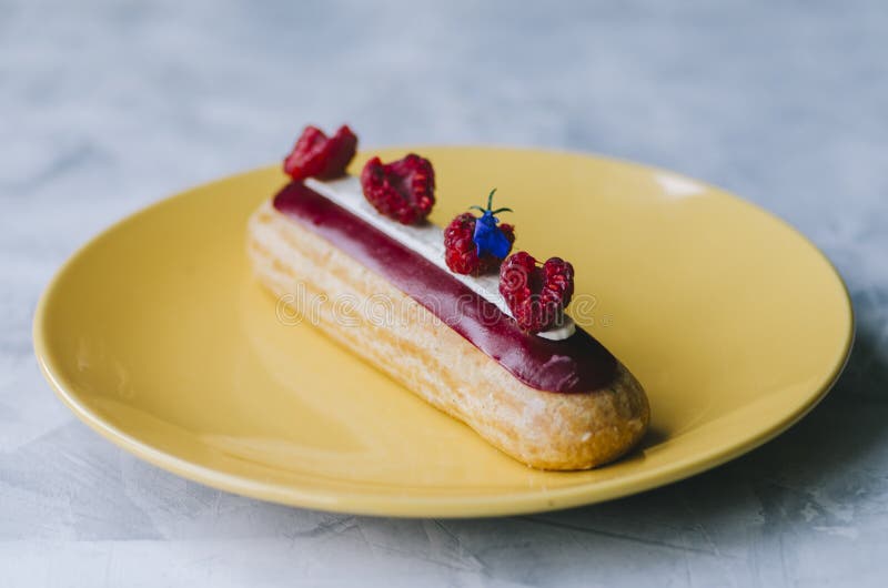 Eclair with Berries stock image. Image of chocolate - 126200239