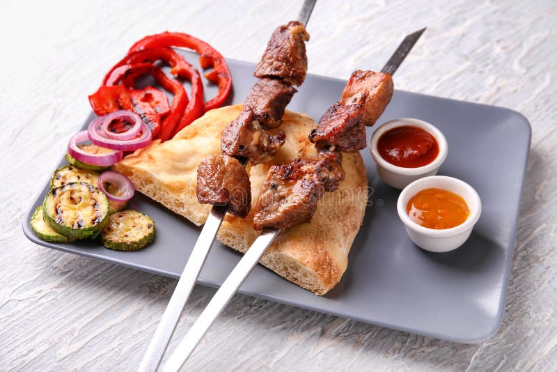 Tasty Flatbread with Pieces of Shish-kebab, Vegetables and Sauces on ...