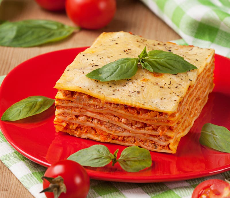 Tasty Flavorful Lasagna on a Plate and Ingredients Stock Photo - Image ...