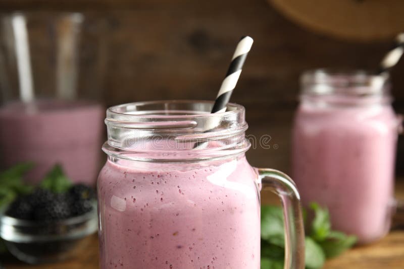 Tasty Fresh Milk Shake with Straw in Mason Jar, Closeup Stock Photo ...
