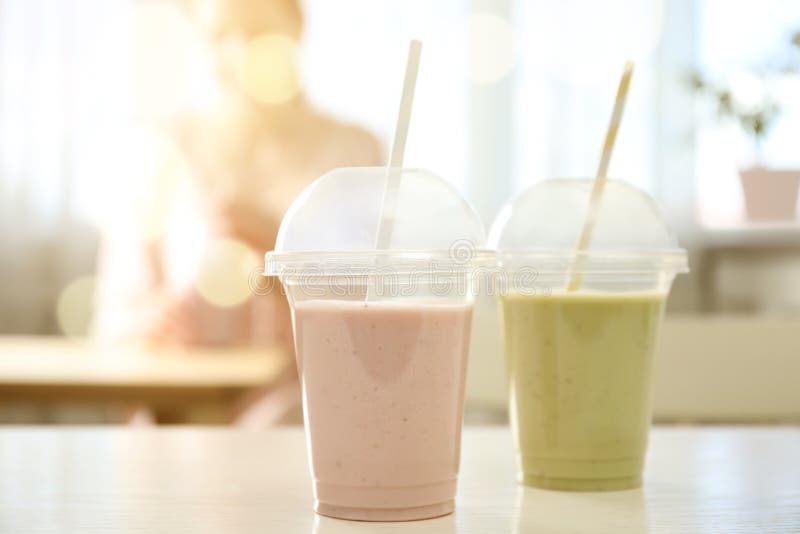 Tasty Fresh Milk Shakes in Plastic Cups in Cafe Stock Image - Image of ...