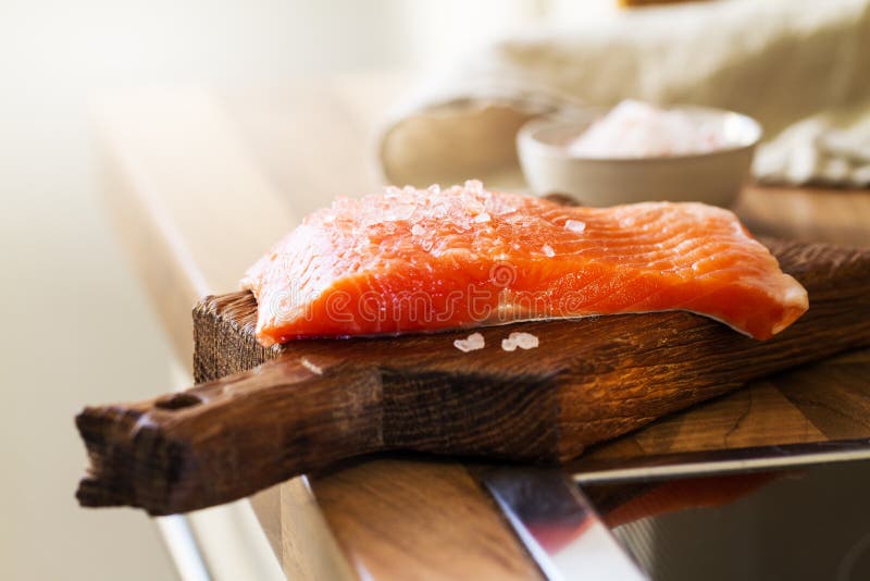 Tasty Fresh Salmon Fish on a Cooking Board on a Kitchen Background ...