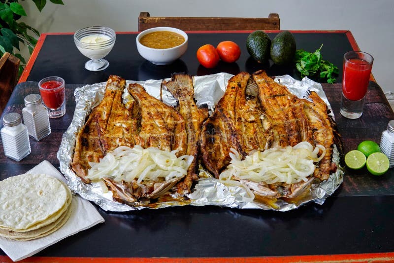 Tasty Grilled Fish with Mexican Dishes on the Table Stock Photo - Image ...