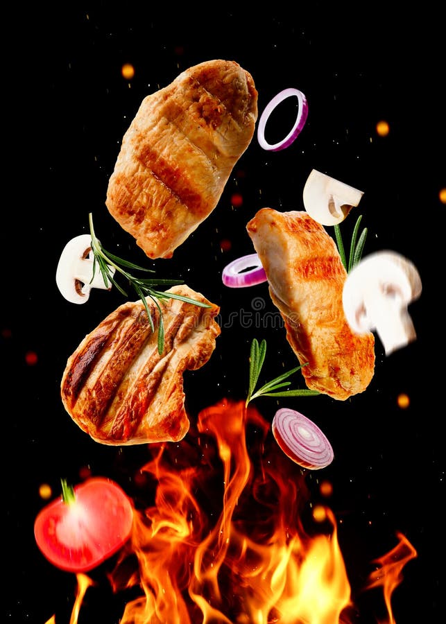 Tasty Grilled Meat, Different Vegetables and Fire Flame on Dark ...