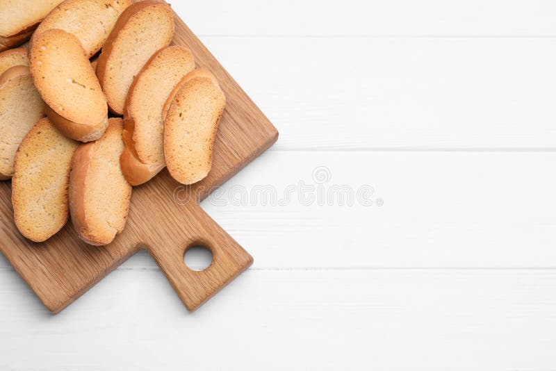 Tasty Hard Chuck Crackers on White Wooden Table, Top View. Space for ...