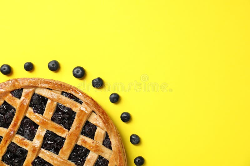 Tasty Homemade Pie with Blueberries on Yellow Table, Top View. Space ...