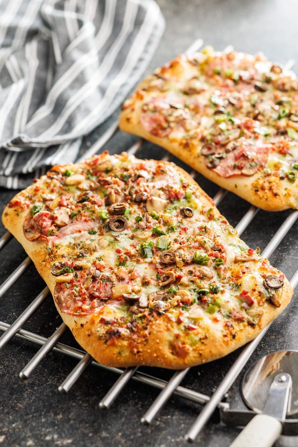 Tasty Italian Square Pizza on Kitchen Table Stock Image - Image of ...