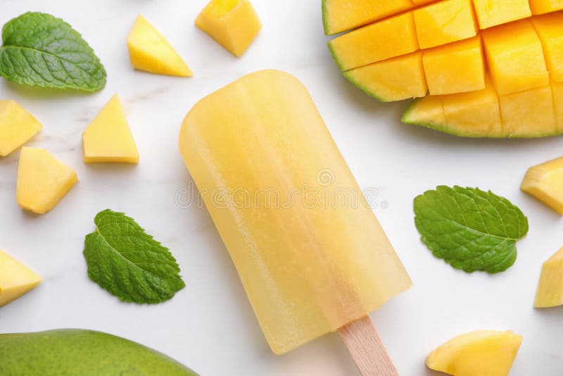 Tasty Mango Ice Pop on White Marble Table, Flat Lay. Fruit Popsicle ...