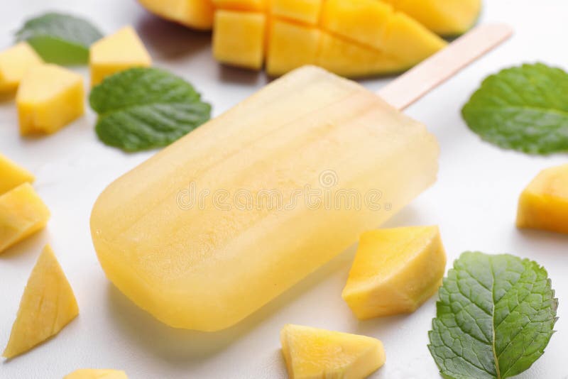 Tasty Mango Ice Pop on White Table, Closeup. Fruit Popsicle Stock Image ...