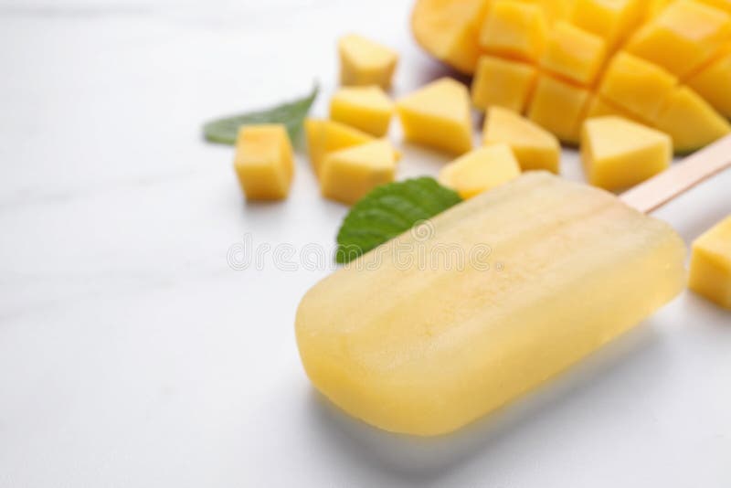 Tasty Mango Ice Pop on White Table, Space for Text. Fruit Popsicle ...