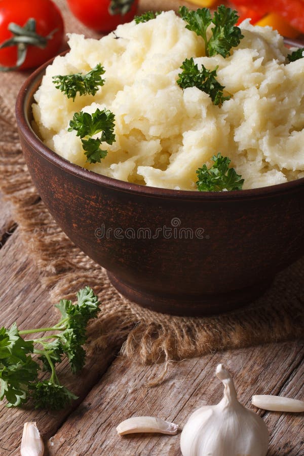 Tasty Mashed Potatoes with Parsley in a Bowl Close-up Vertical Stock ...