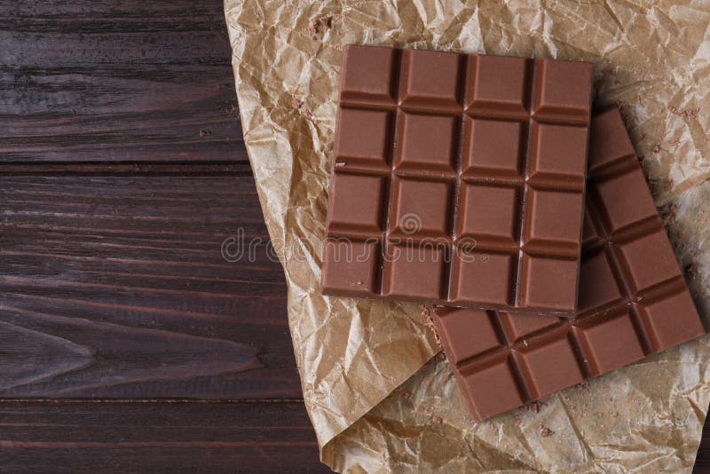 Tasty Milk Chocolate Bars on Wooden Table, Flat Lay. Space for Text ...