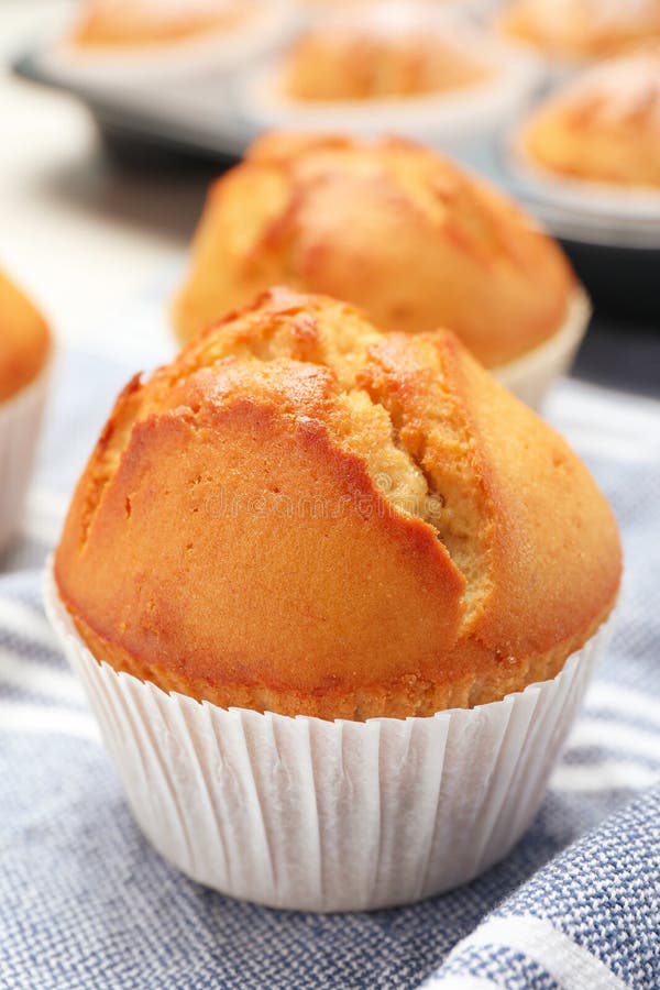 Tasty Muffin in Paper Cup on Table, Closeup Stock Image - Image of ...