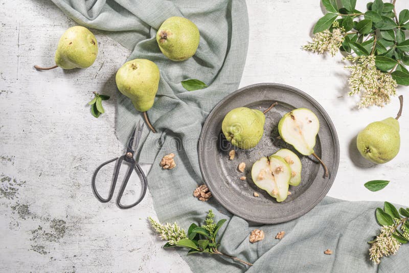 Tasty Pears with Nuts. a Table Decorated with Flowers and a Plate of ...