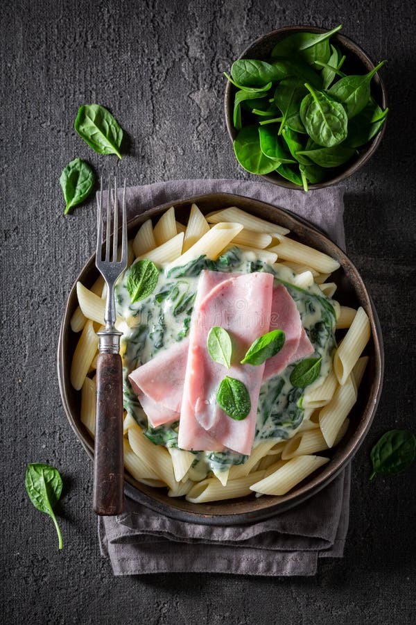Tasty Penne with Spinach, Bechamel Sauce and Ham Stock Image - Image of ...