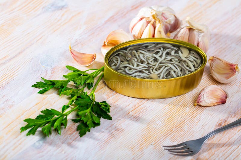 Tasty Pickled Eels on Background Garlic and Greens at Table Stock Photo ...