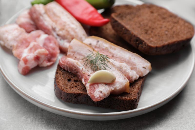 Tasty Pork Fatback with Rye Bread and Spices on Grey Table, Closeup ...