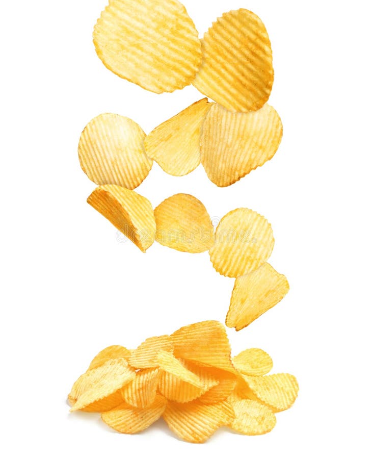 Tasty potato chips falling stock photo. Image of creative - 130887908