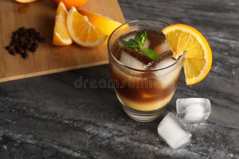 Tasty Refreshing Drink with Coffee and Orange Juice on Marble Table ...
