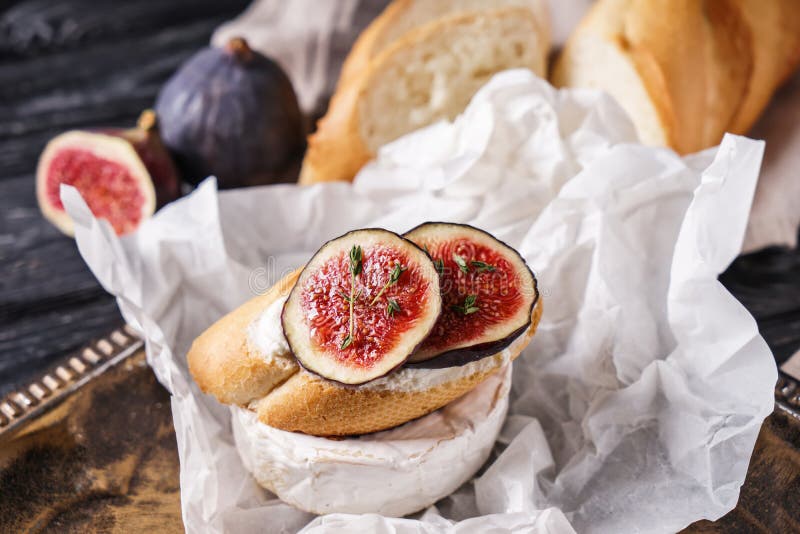 Tasty Sandwich with Ripe Fig and Cheese on Parchment Stock Image ...