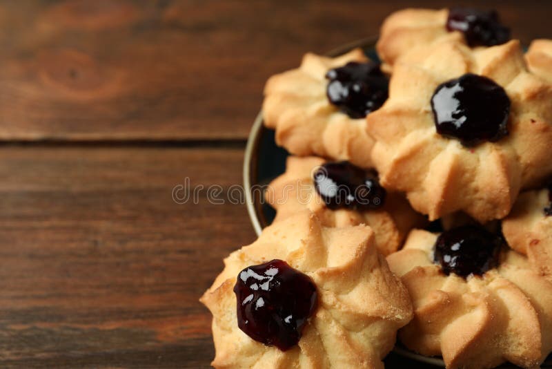 Tasty Shortbread Cookies with Jam on Wooden Table, Closeup. Space for ...