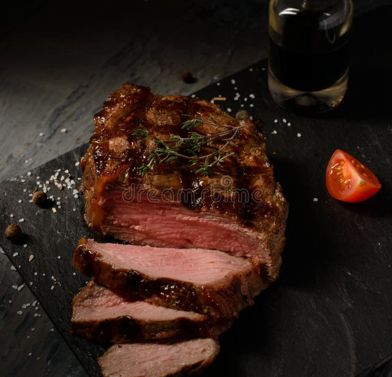 Tasty Stake Against a Black Background Stock Photo - Image of meat ...