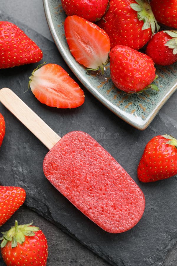 Tasty Strawberry Ice Pop on Dark Table, Flat Lay. Fruit Popsicle Stock ...