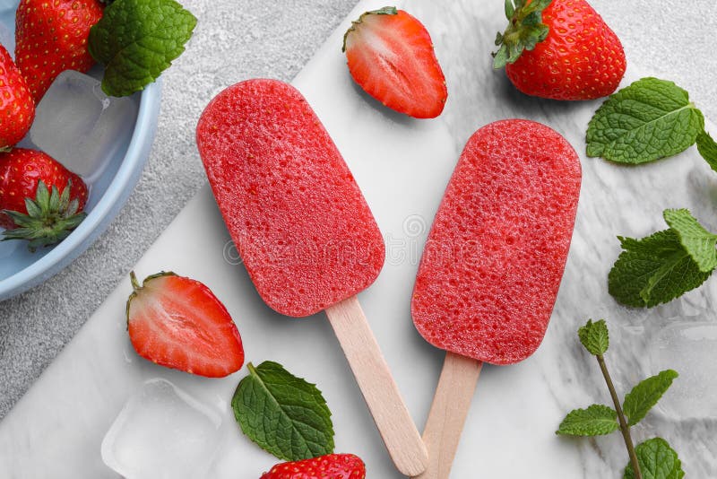 Tasty Strawberry Ice Pops on Grey Table, Flat Lay. Fruit Popsicle Stock ...
