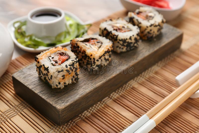Tasty Sushi on Wooden Stand Stock Photo - Image of product, cook: 151351772