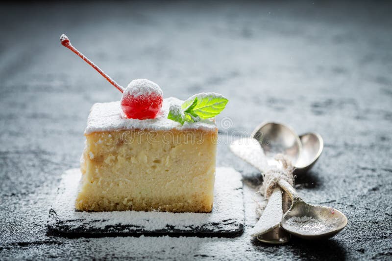 Tasty and Sweet Cheesecake with Cherry and Falling Sugar Stock Image ...