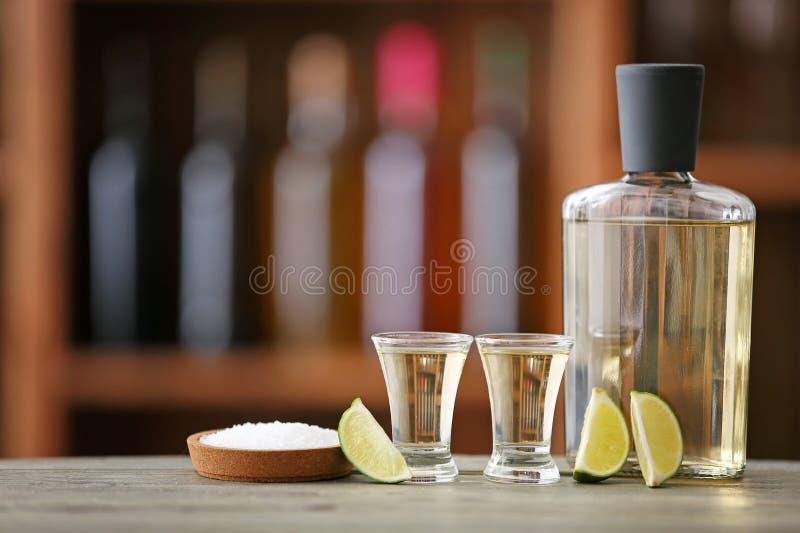 Tasty Tequila with Lime and Salt on Table in Bar Stock Photo - Image of ...