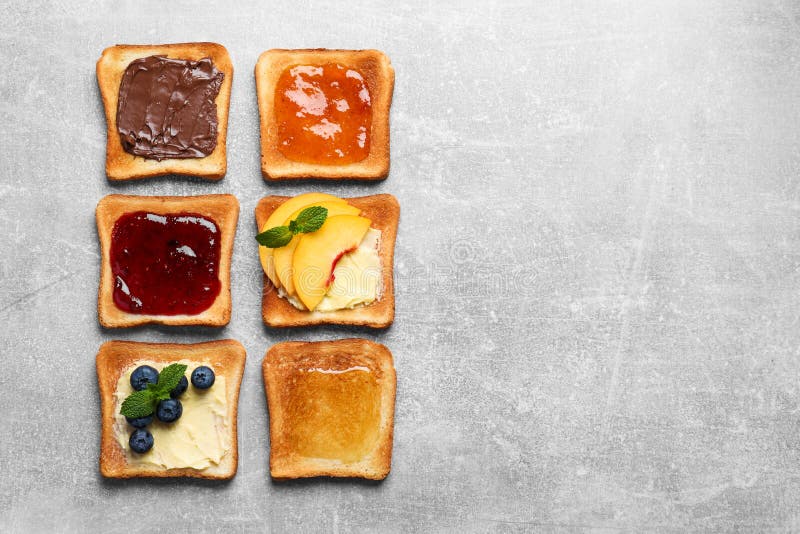 Tasty Toasts with Different Spreads and Fruits on Light Grey Table ...