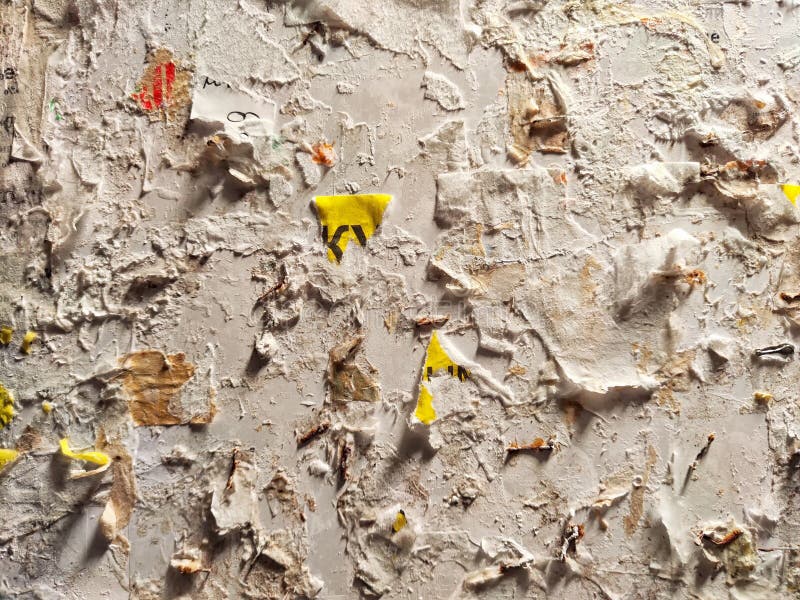 Tattered Posters on a Weathered Urban Wall. Layers of Torn Posters ...