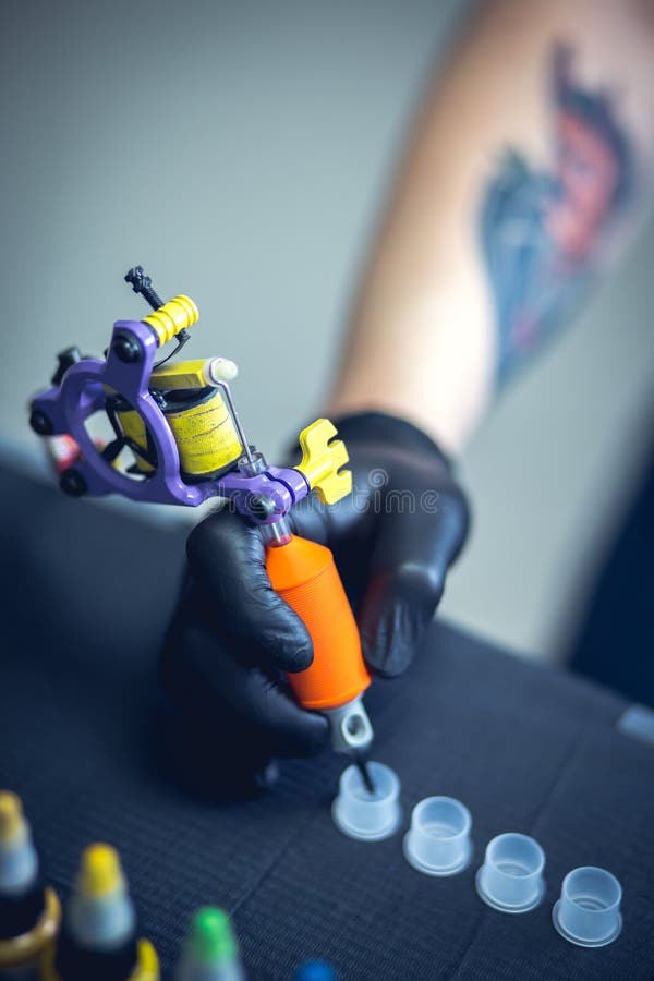 Hand Tattoo Artist with the Tattoo Machine Stock Photo - Image of model ... Hand Tattoo Artist with the Tattoo Machine Stock Photo - Image of model ...