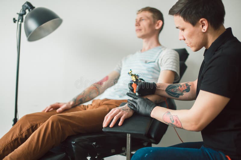 Tattoo Artist Makes a Tattoo Stock Photo - Image of black, concept ...