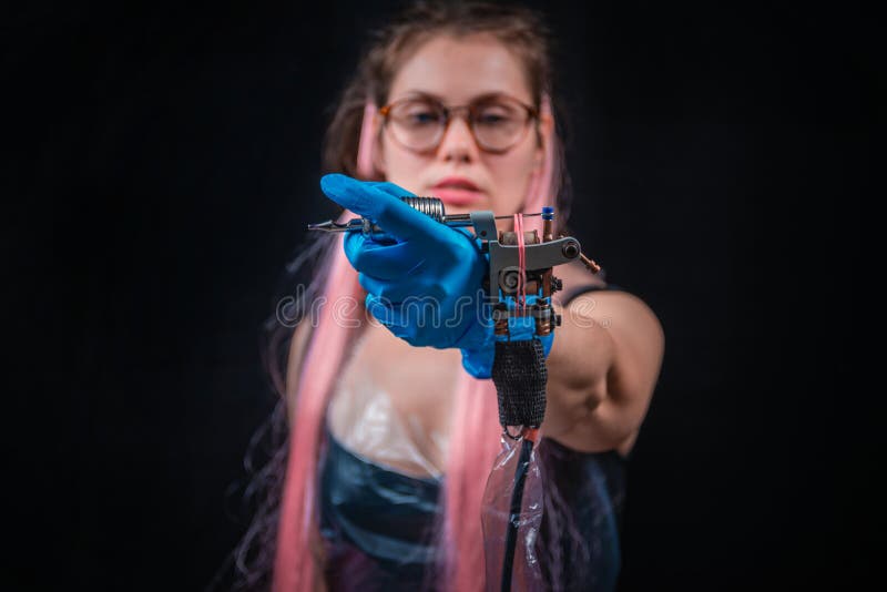 Tattoo Artist with a Tattoo-machine in Studio Stock Image - Image of ... Tattoo Artist with a Tattoo-machine in Studio Stock Image - Image of ...