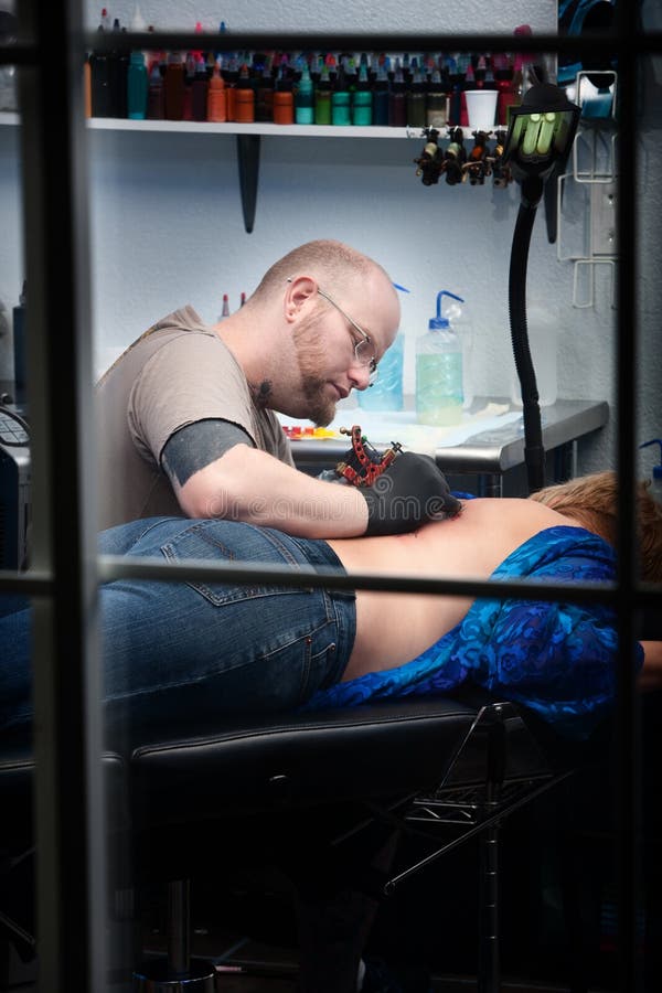 Tattoo Artist at Work stock image. Image of caucasian - 24252571
