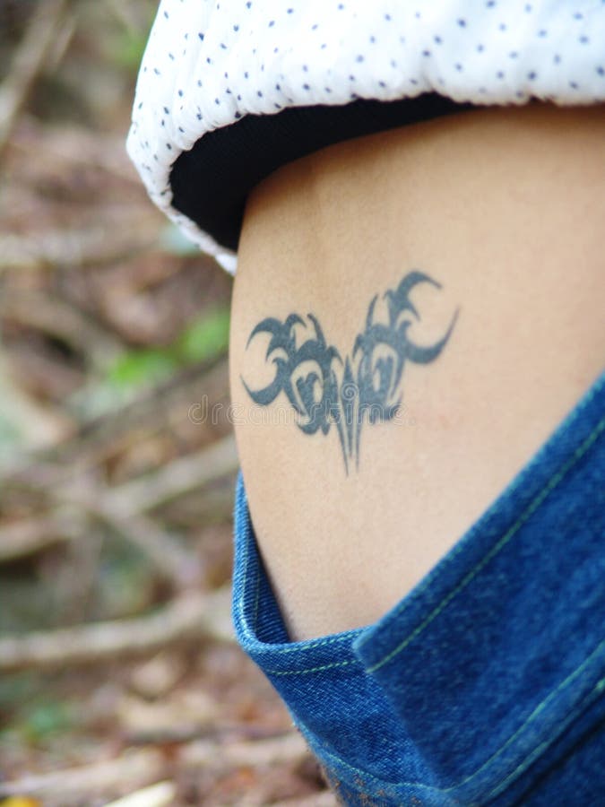 Tattoo on the back editorial stock photo. Image of female - 1797488