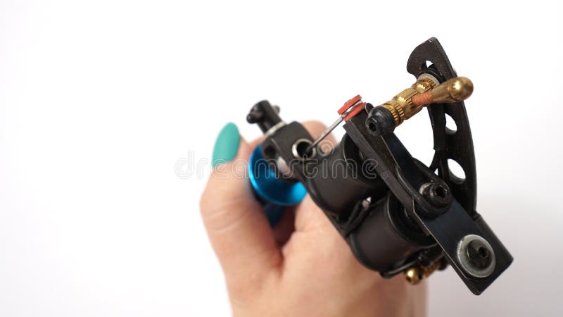 Tattoo Machine on Tattoo Artist Hand on White Background Stock Photo ...