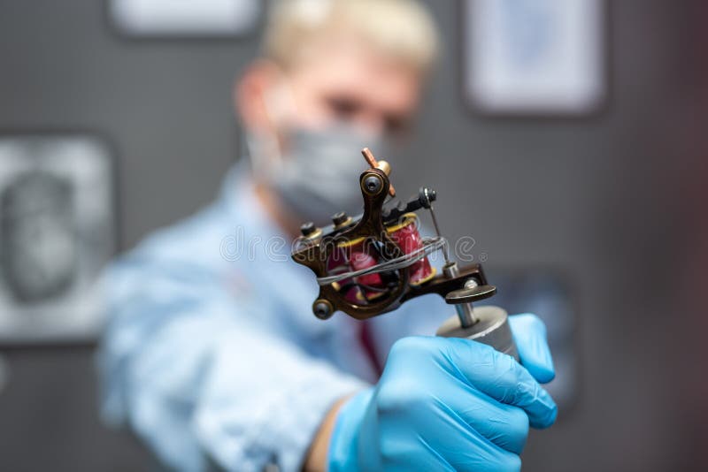 Tattoo Machine Close-up in the Hands of a Tattoo Artist. Stock Photo ...