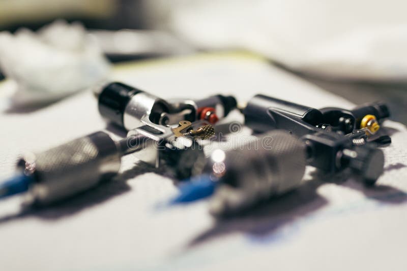 Tattoo Machine is on the Table in a Tattoo Studio. Stock Image - Image ...