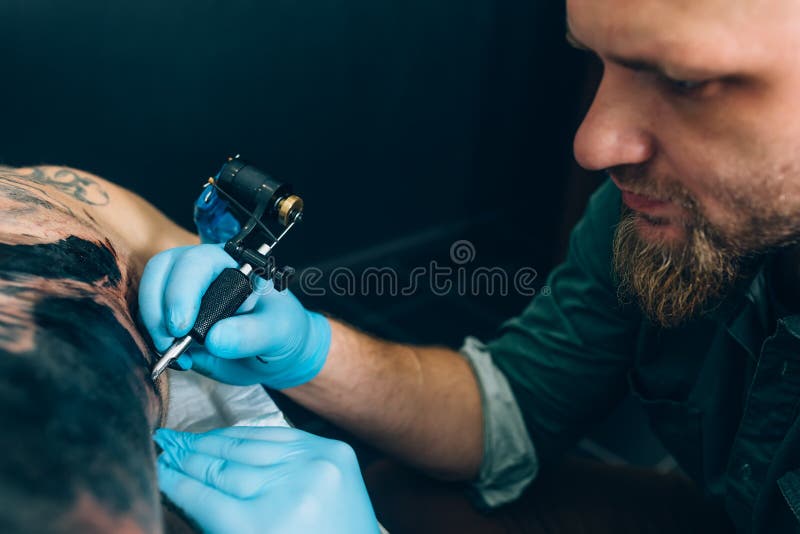 Tattoo Master Artist Makes a Tattoo. Closeup Stock Image - Image of ...