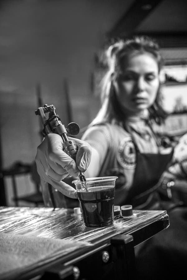Master of the Art of Tattooing Does a Tattoo in the Studio Stock Image ... Master of the Art of Tattooing Does a Tattoo in the Studio Stock Image ...