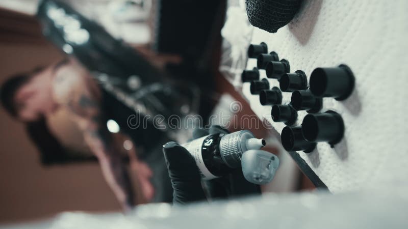 Tattoo Master is Preparating Ink before Work Start. Tattoo Ink ...
