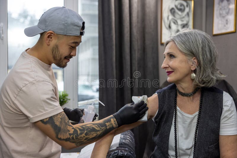 Tattoo Master Preparing Client for a Tattoo Session Stock Photo - Image ...