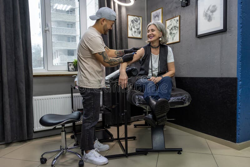 Tattoo Master Preparing Client for a Tattoo Session Stock Image - Image ...