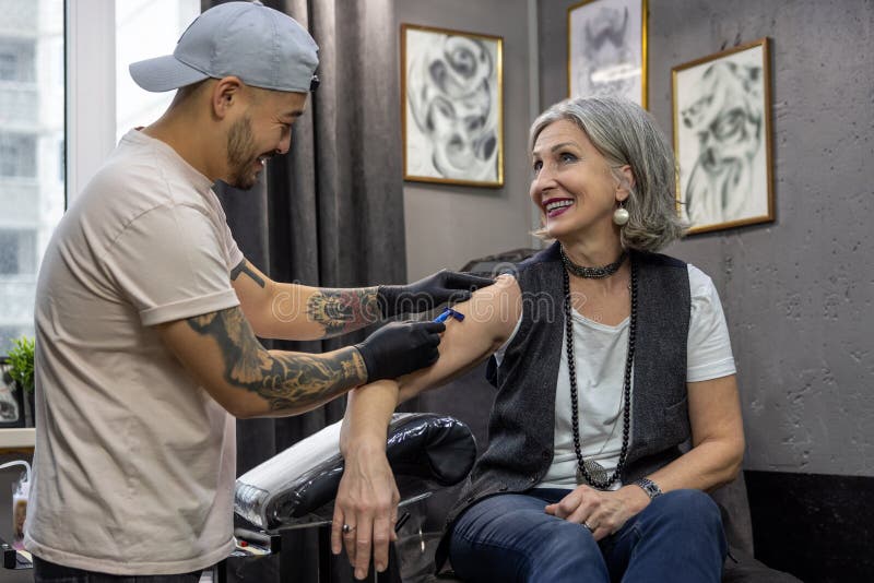 Tattoo Master Preparing Client for a Tattoo Session Stock Image - Image ...