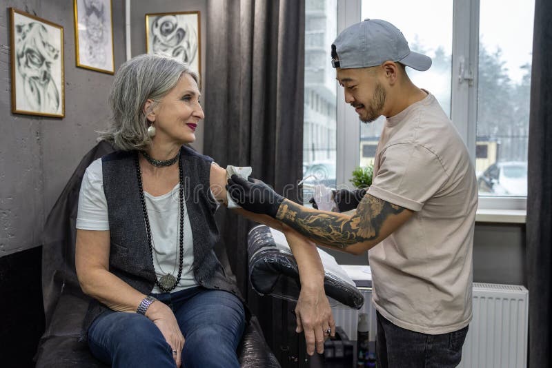 Tattoo Master Preparing Client for a Tattoo Session Stock Photo - Image ...