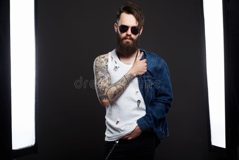 Tattooed Handsome Bearded Man in Sunglasses and Denim Stock Image ... Tattooed Handsome Bearded Man in Sunglasses and Denim Stock Image ...